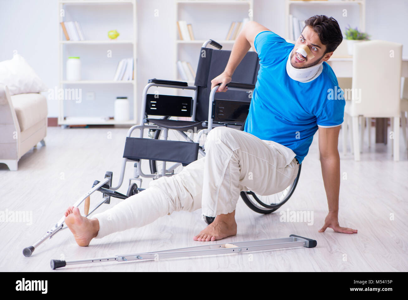 Injured young man recovering at home Stock Photo - Alamy