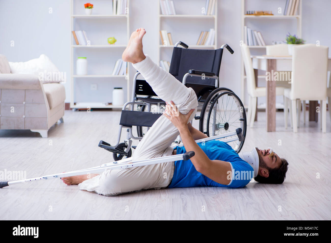Injured young man recovering at home Stock Photo - Alamy