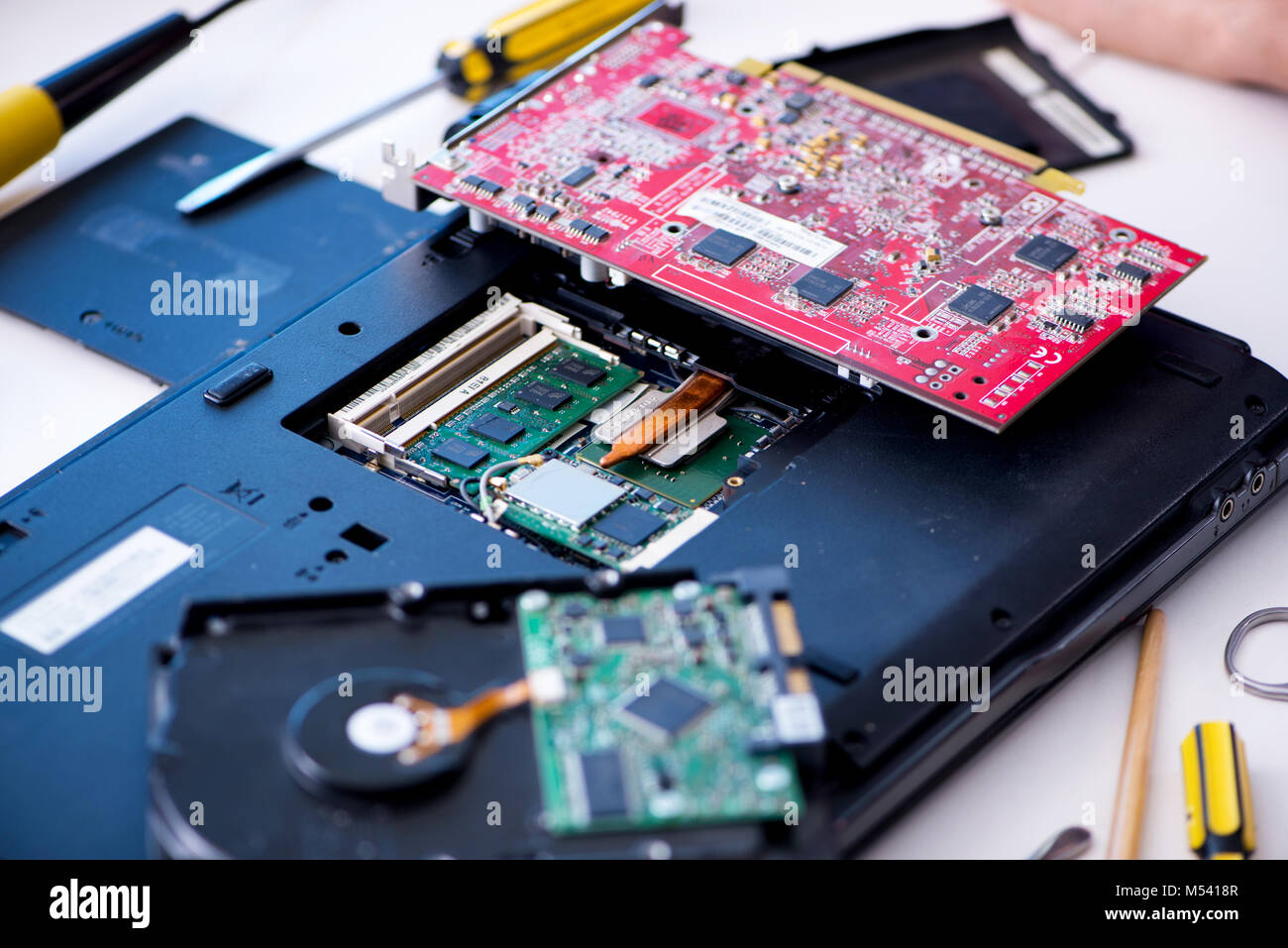 Repairman working in technical support fixing computer laptop tr Stock ...