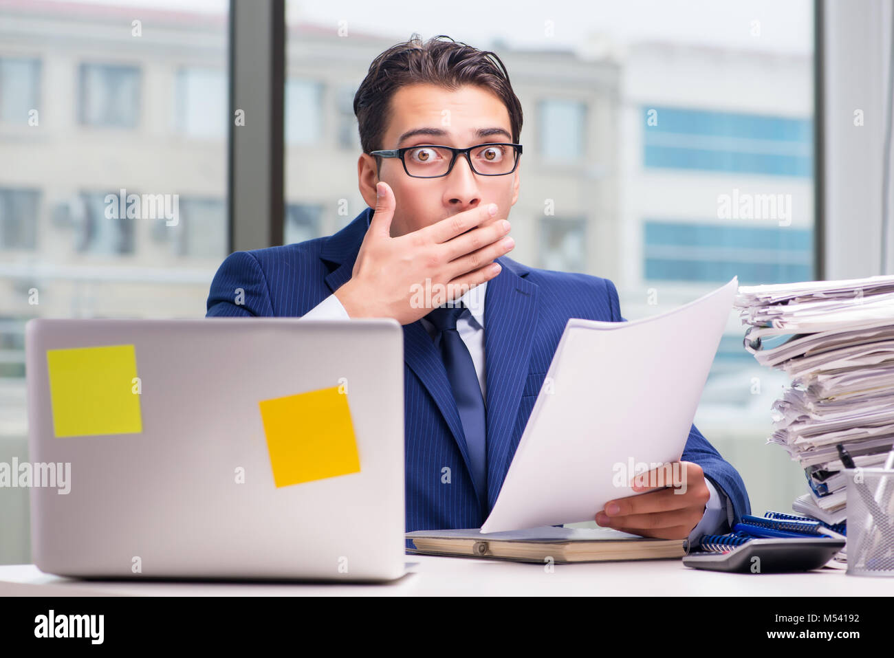 Workaholic businessman overworked with too much work in office Stock ...