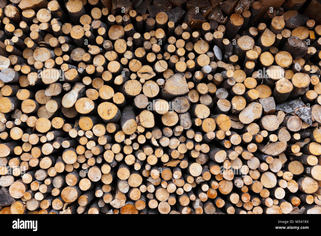 Firewood logs wood background Stock Photo - Alamy