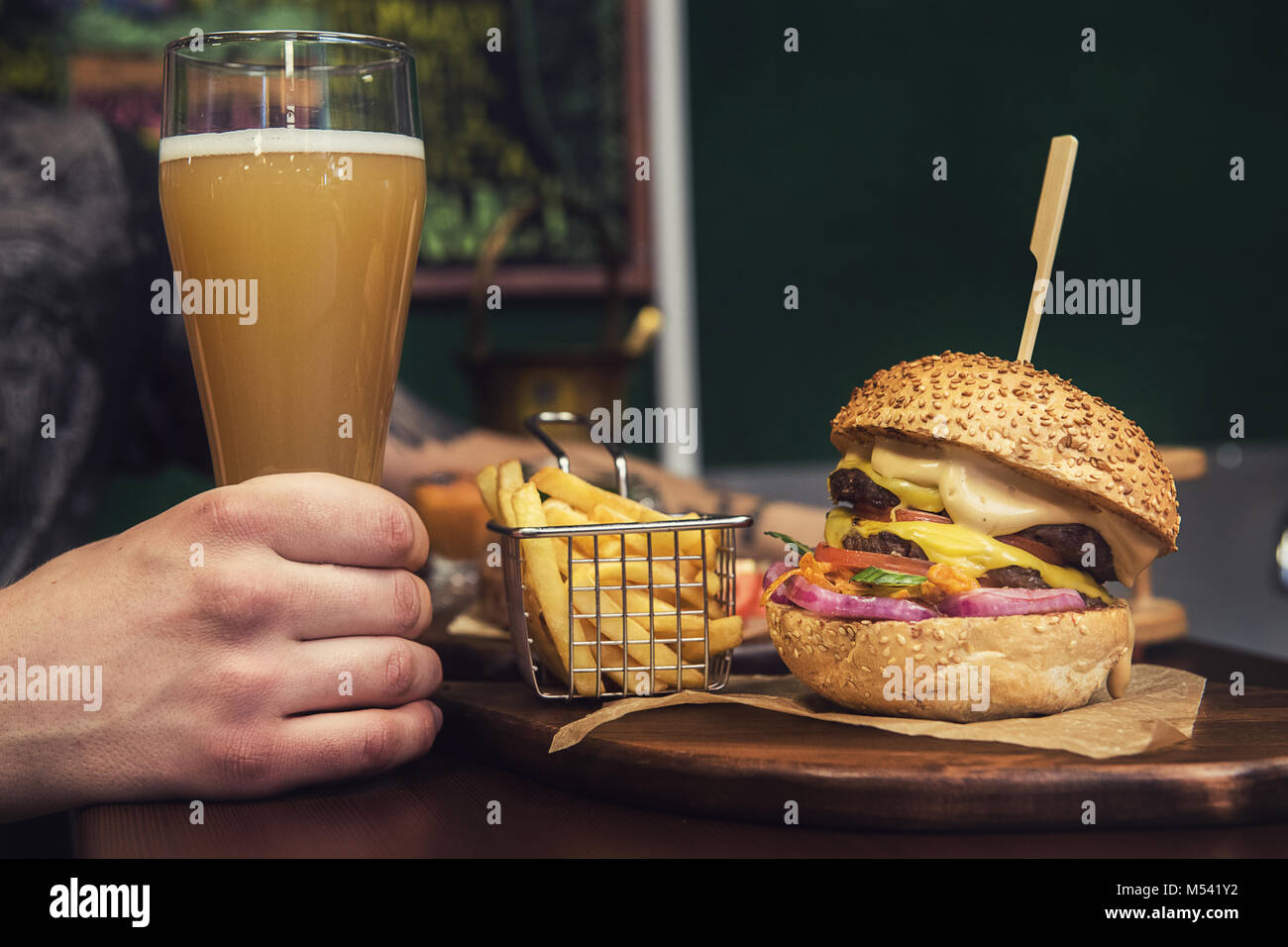 Man eating burgers Stock Photo - Alamy