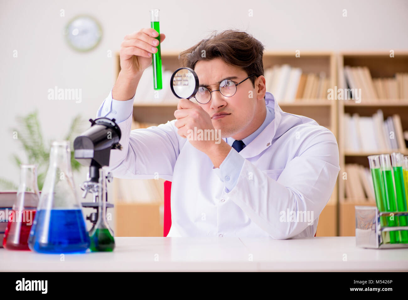 Mad crazy scientist doctor doing experiments in a laboratory Stock ...