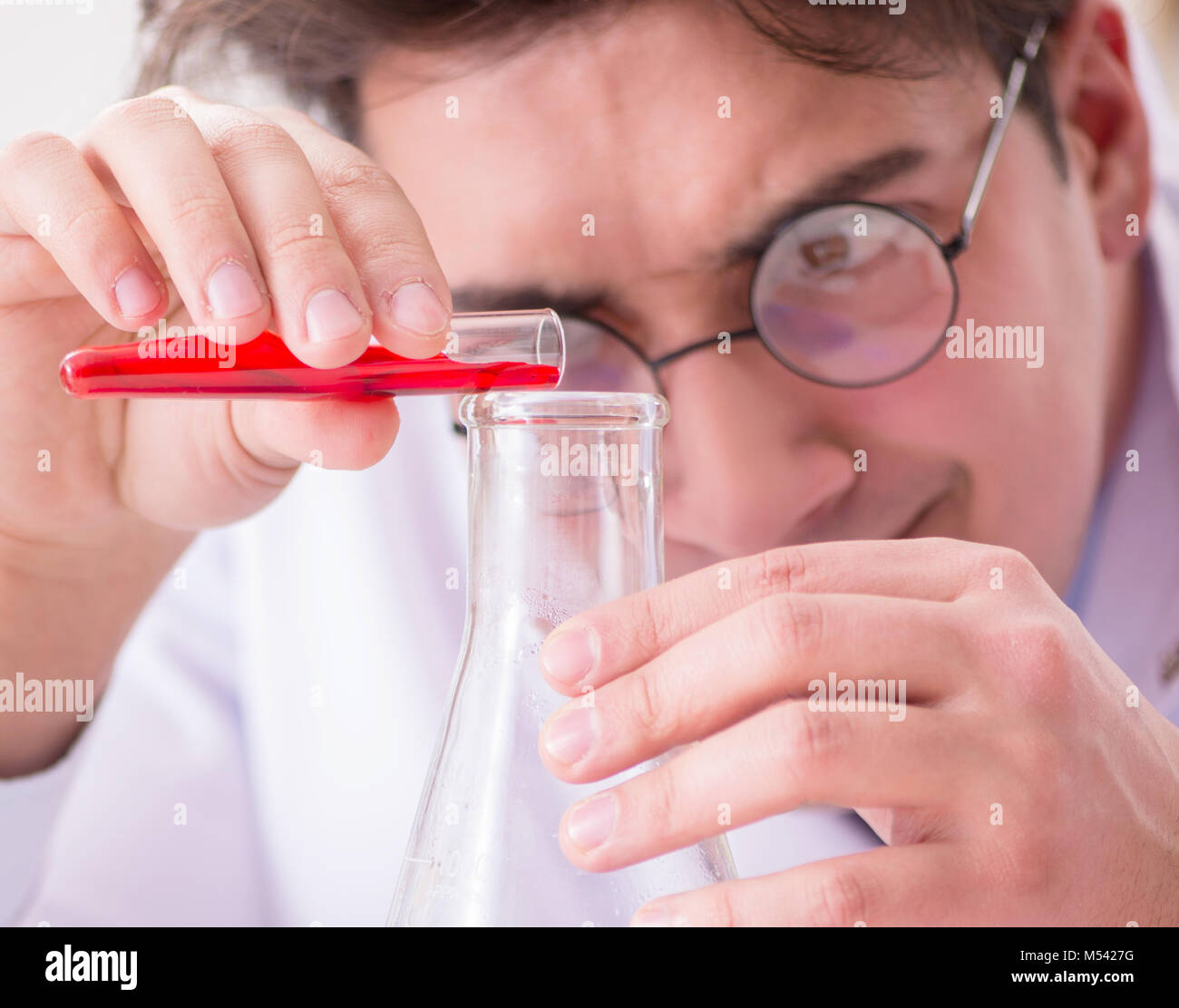 Mad crazy scientist doctor doing experiments in a laboratory Stock ...