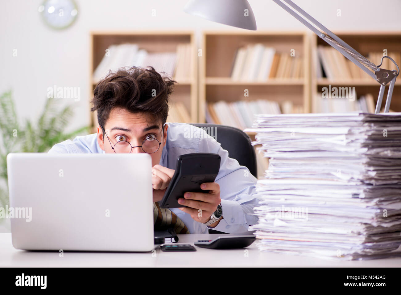 Funny accountant bookkeeper working in the office Stock Photo - Alamy