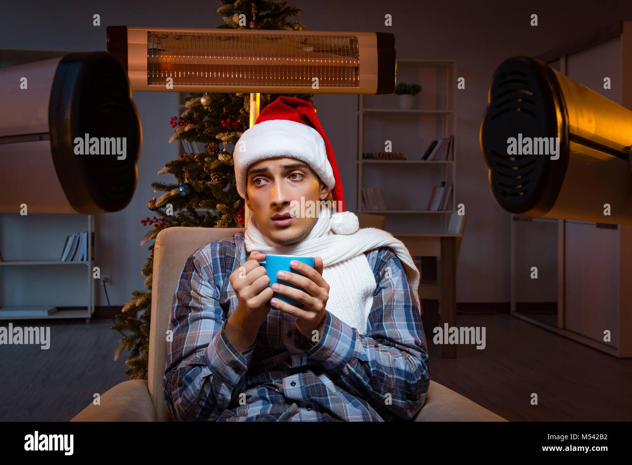 Man suffering from cold at home Stock Photo - Alamy