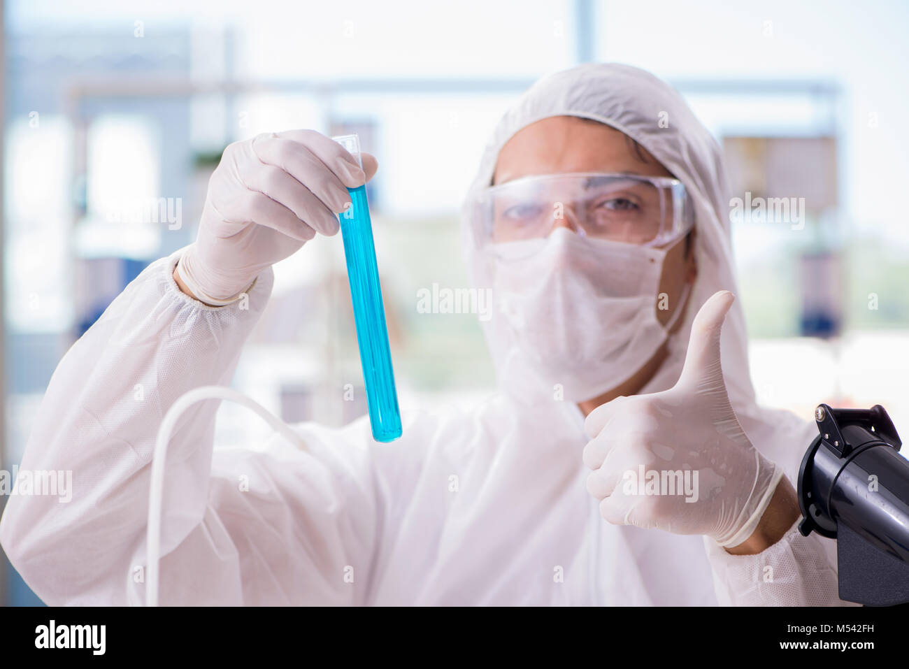 Chemist working in the laboratory with hazardous chemicals Stock Photo ...
