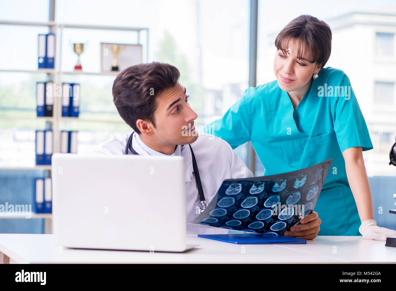 Two doctors discussing patient mri hi-res stock photography and images ...