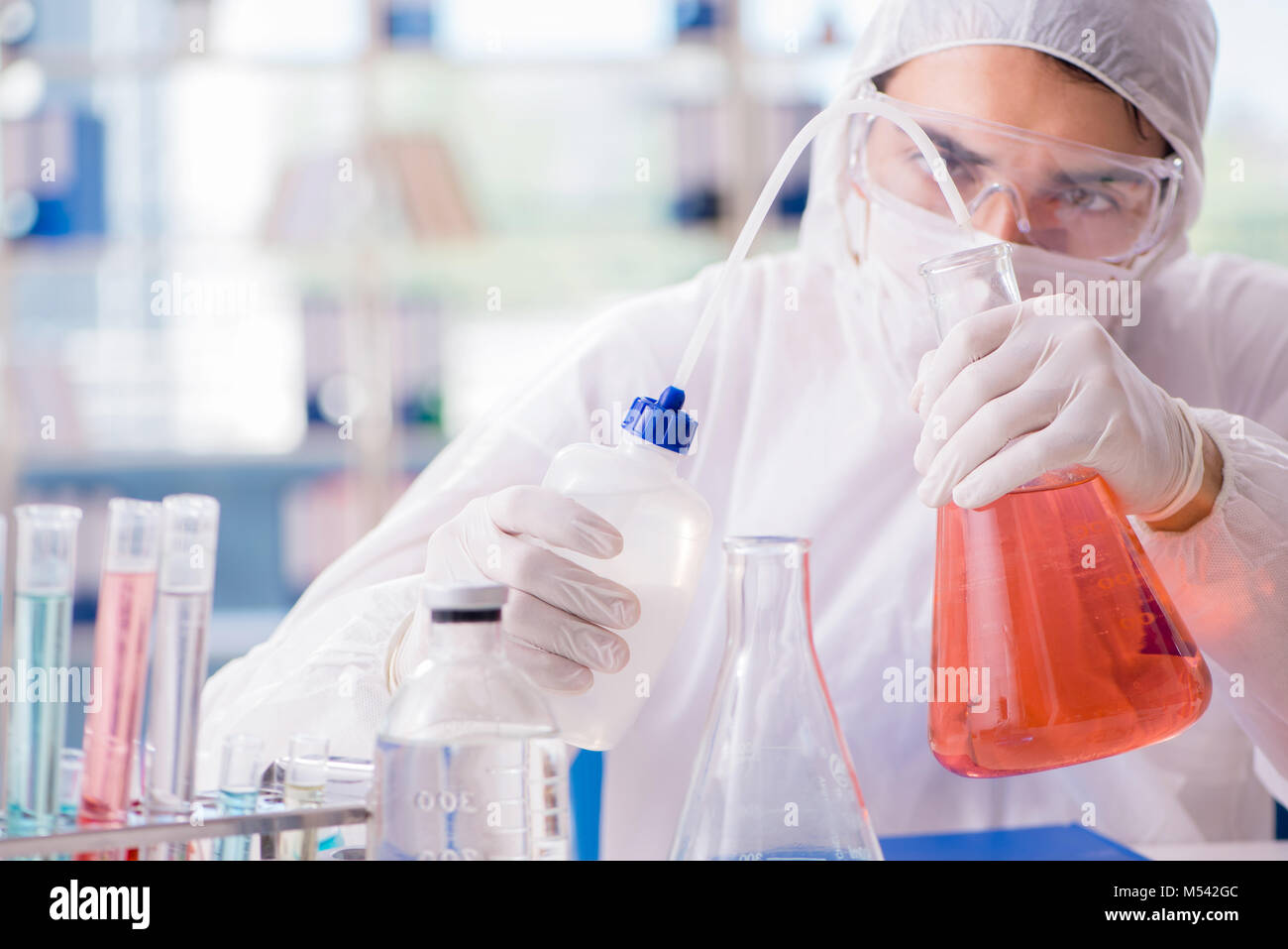Chemist working in the laboratory with hazardous chemicals Stock Photo ...
