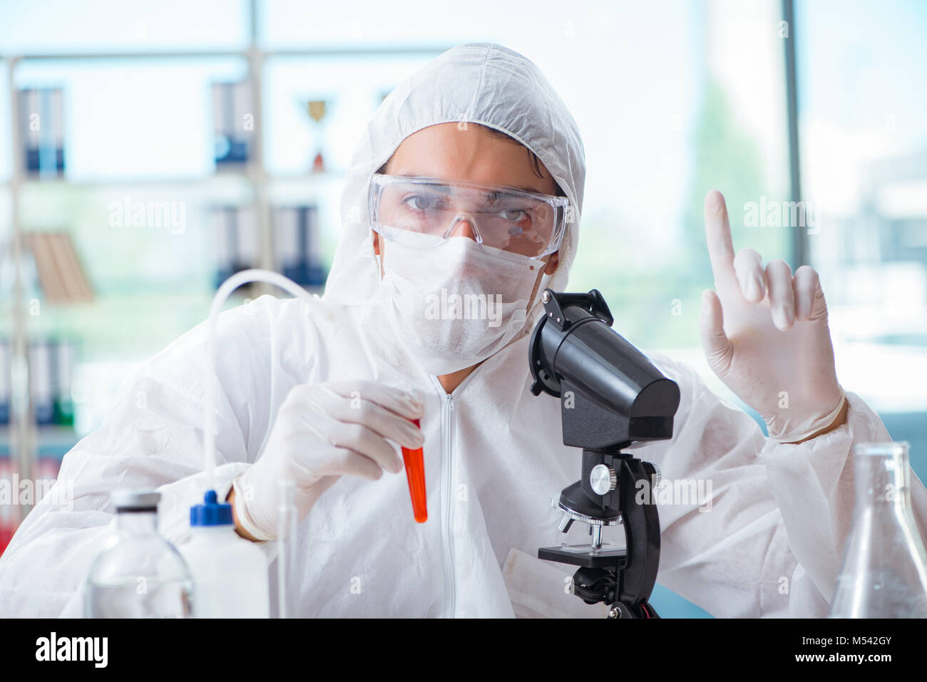 Chemist working in the laboratory with hazardous chemicals Stock Photo ...
