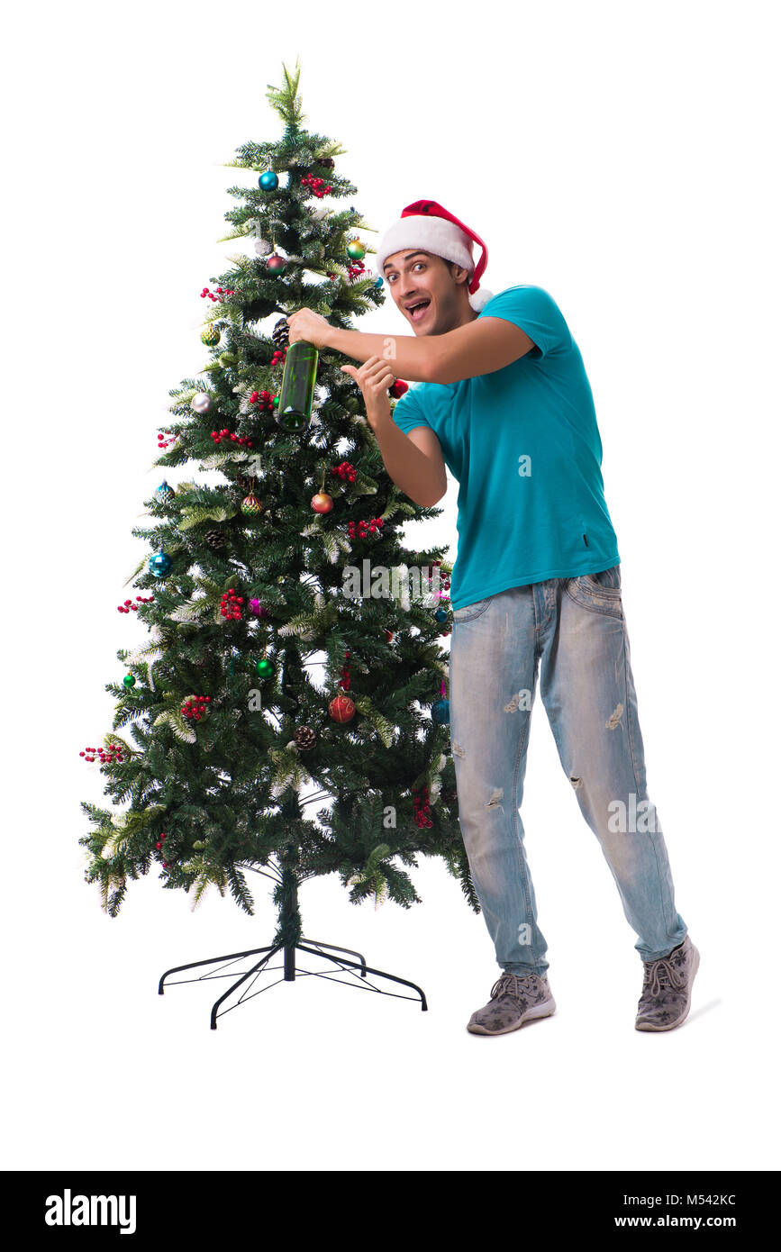 Young man decorating christmas tree isolated on white Stock Photo - Alamy