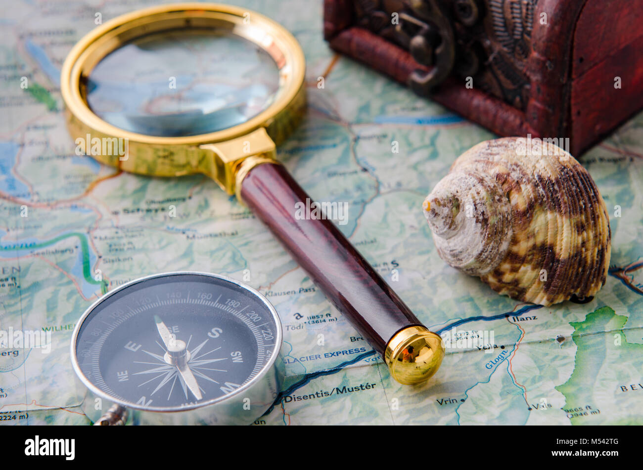 Travel concept with compass and map Stock Photo - Alamy