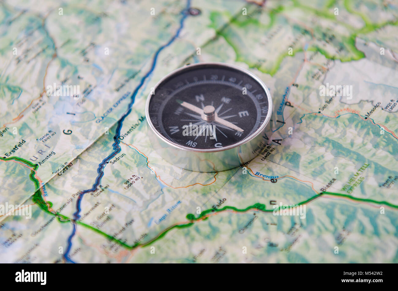 Travel concept with compass and map Stock Photo - Alamy