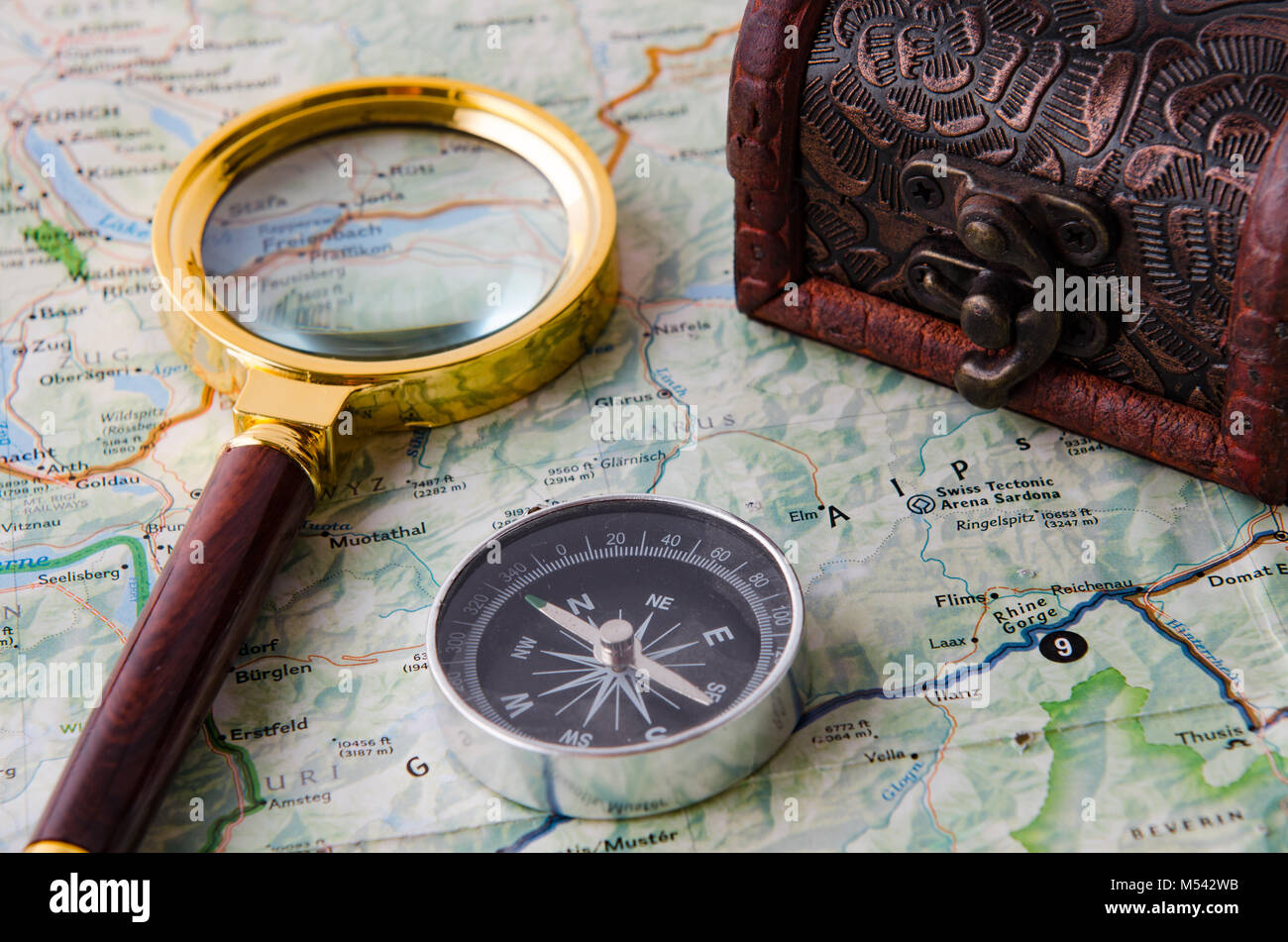 Travel concept with compass and map Stock Photo - Alamy