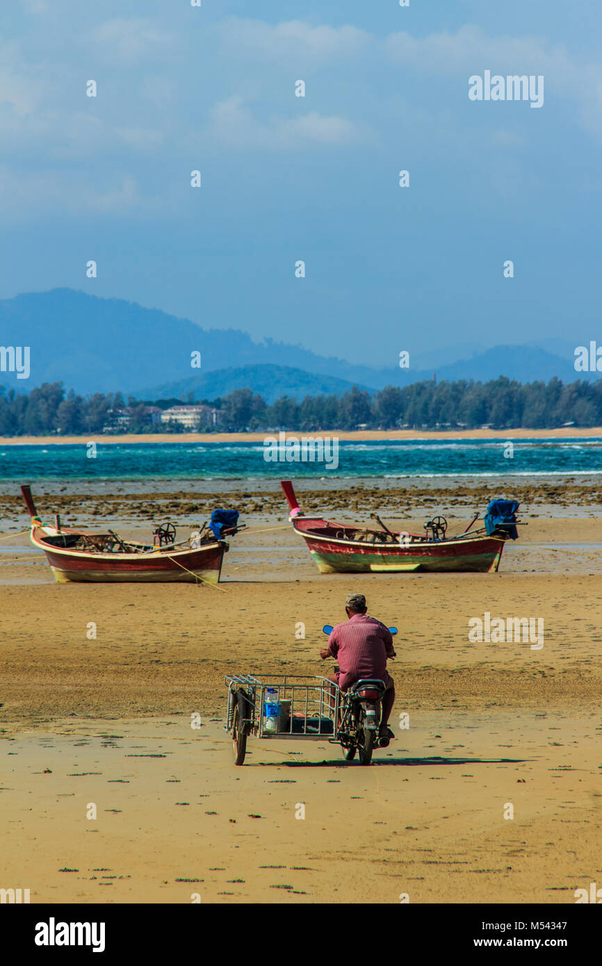 Fisherman was driving the motorcycle wagon to taken equipment to the ...