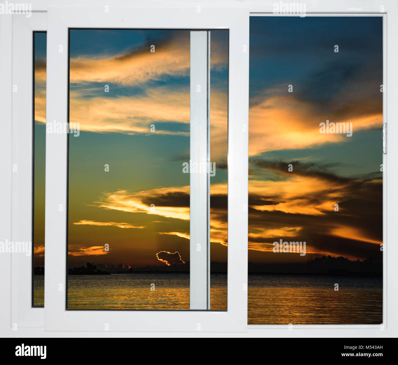 view from the open window of the caribbean sunset Stock Photo - Alamy