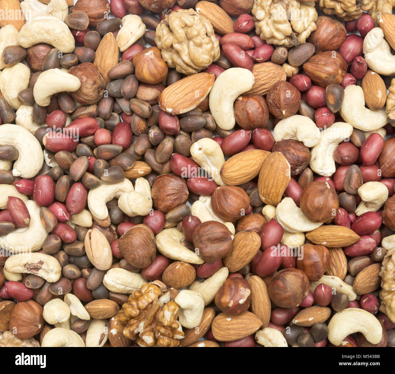 Mixed nuts background Stock Photo - Alamy