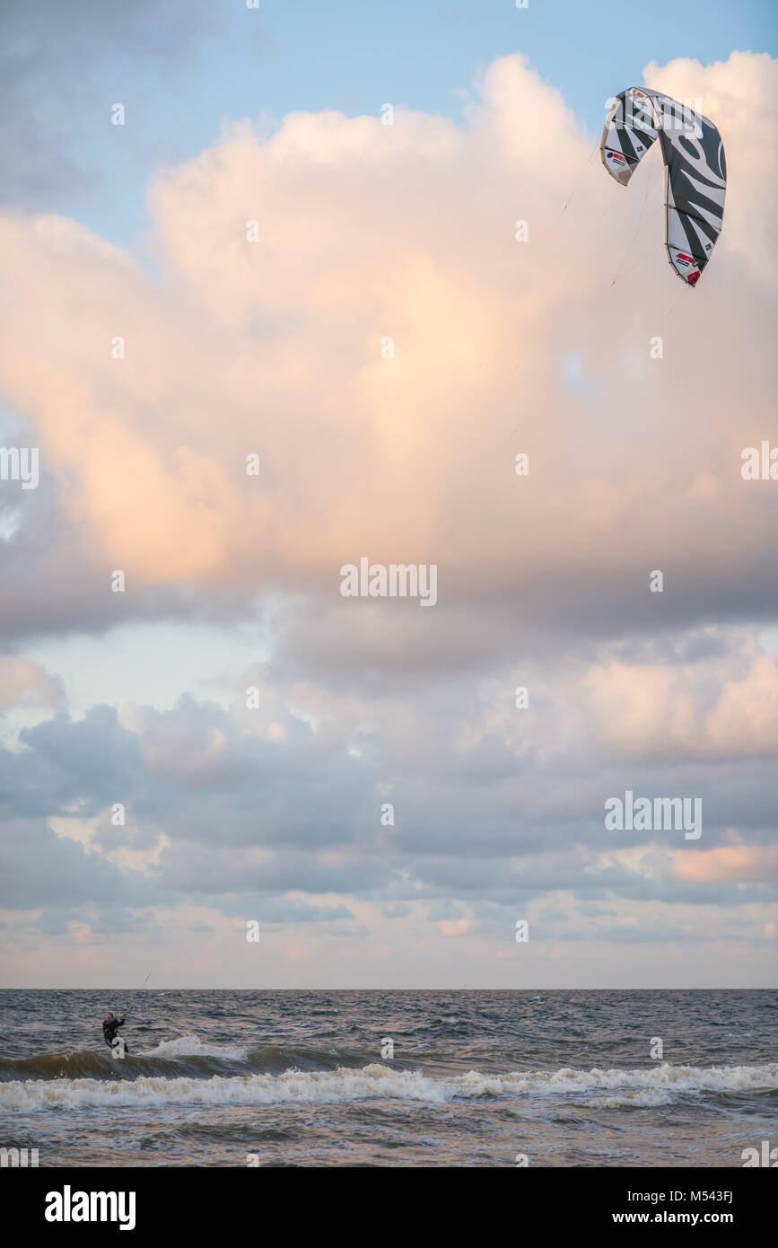 Parachute surfing in the sea at dusk Stock Photo - Alamy
