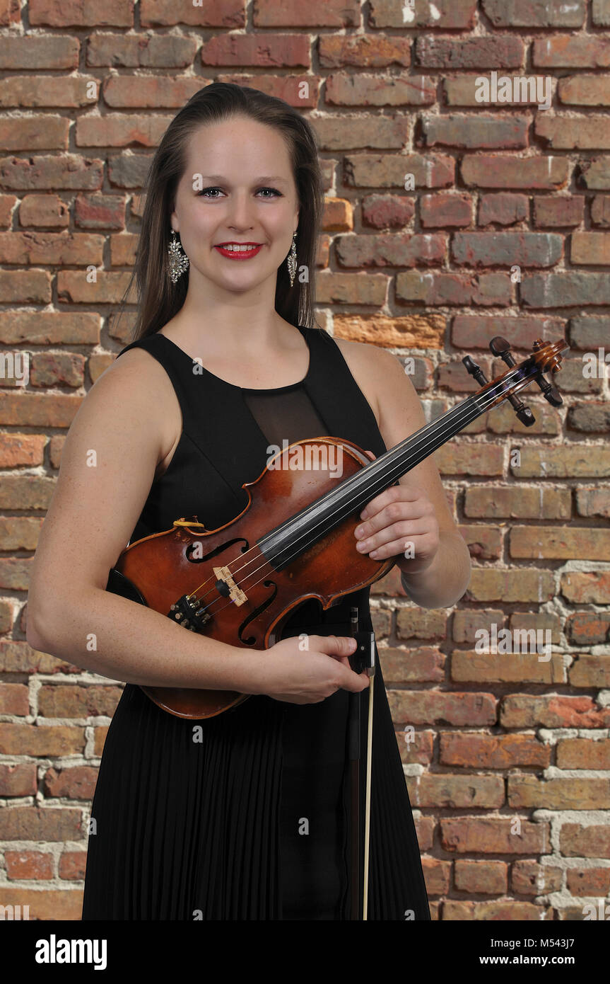 Woman Holding Violin Stock Photo - Alamy