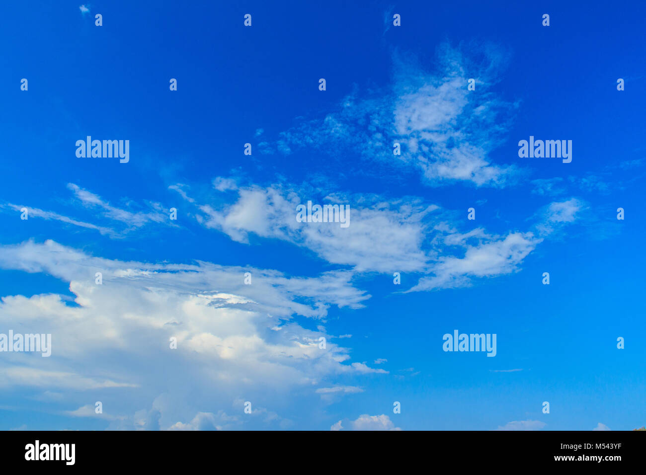 Clear blue sky with white clouds. Cloudless sky. Blue sky with a cloud obscured the view daytime ...