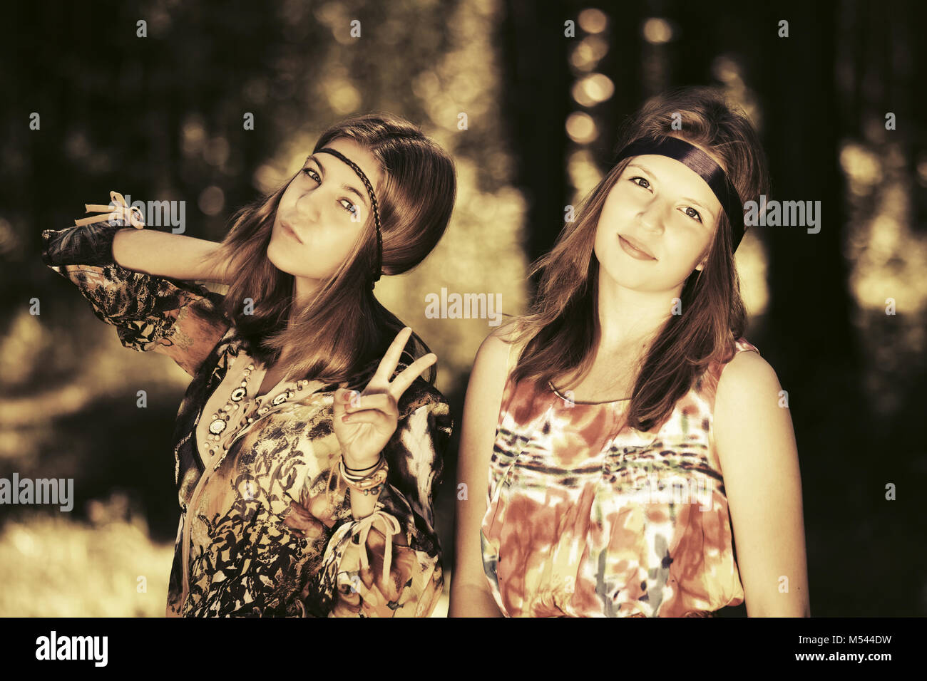 Two happy teen girls in a summer forest Stock Photo - Alamy