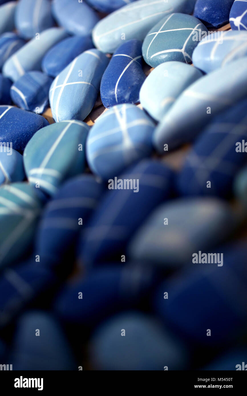 Pebbles with white lines on them Stock Photo - Alamy