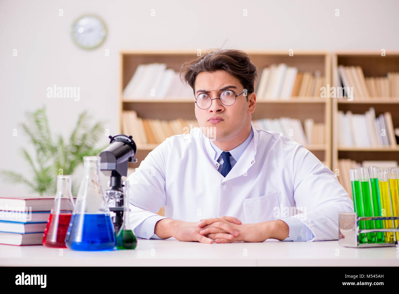 Mad crazy scientist doctor doing experiments in a laboratory Stock ...