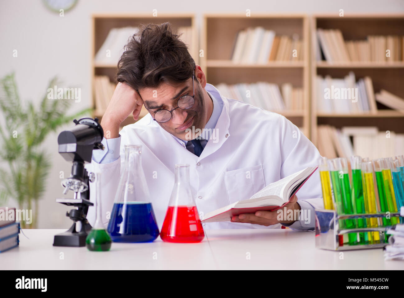 Mad crazy scientist doctor doing experiments in a laboratory Stock ...