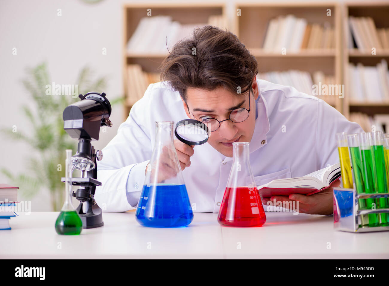 Mad crazy scientist doctor doing experiments in a laboratory Stock ...
