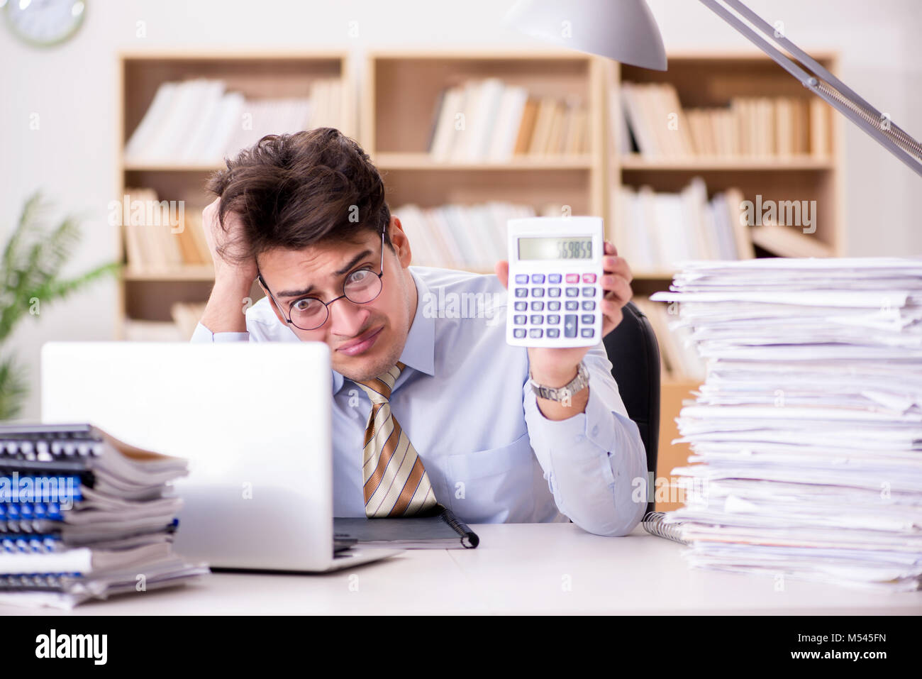 Funny accountant bookkeeper working in the office Stock Photo - Alamy