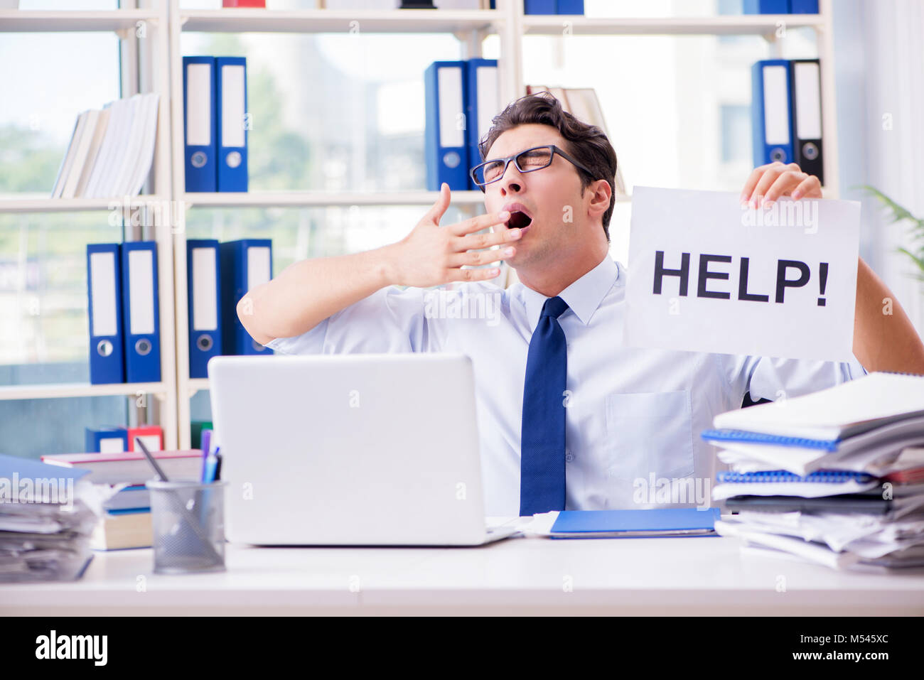 Young businessman asking for help in office Stock Photo - Alamy