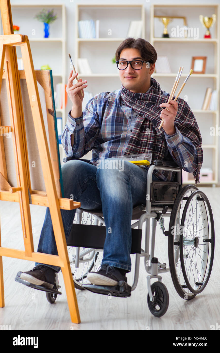 Disabled artist painting picture in studio Stock Photo - Alamy