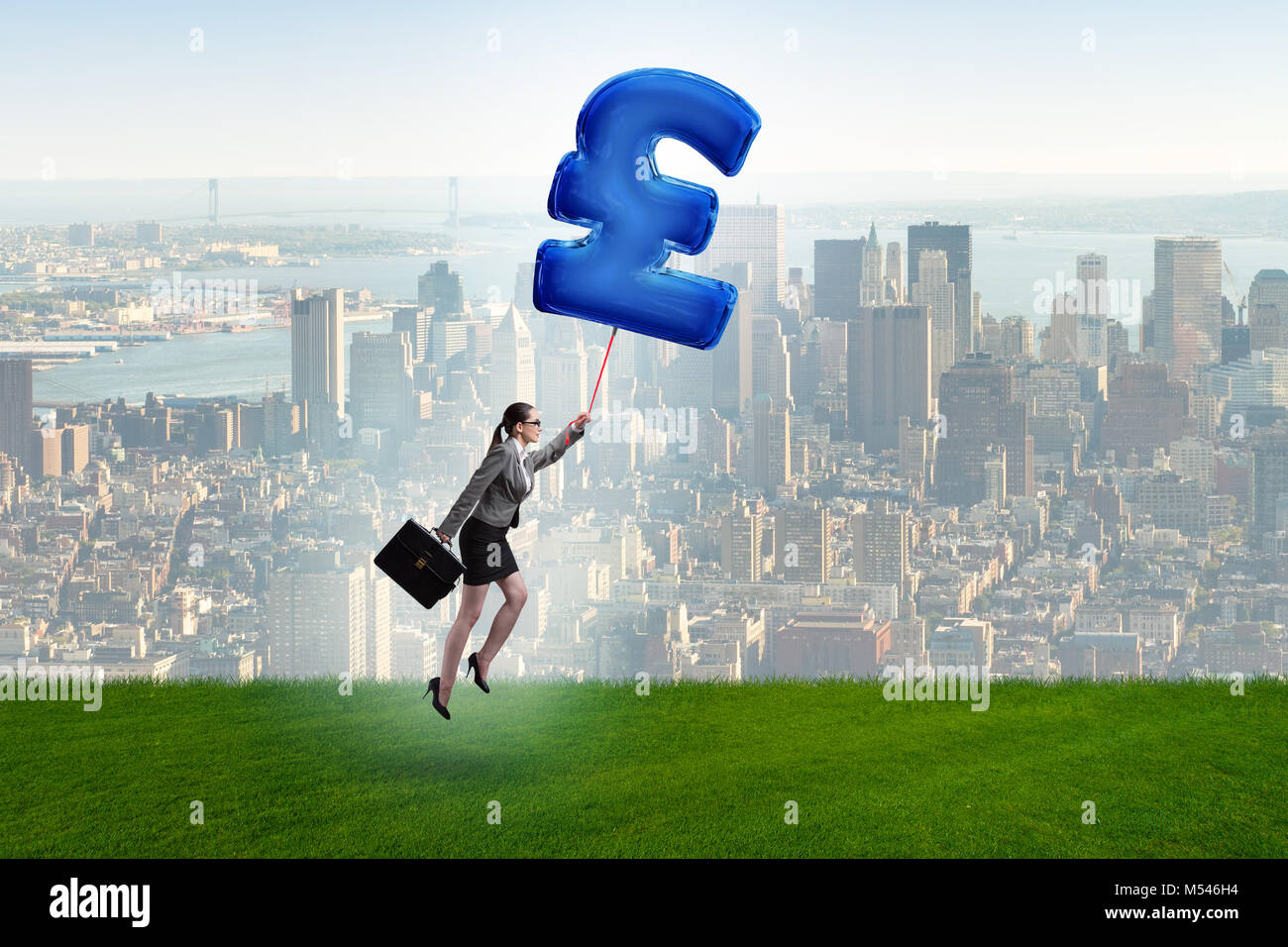 Businesswoman flying on british pound sign inflatable balloon Stock ...