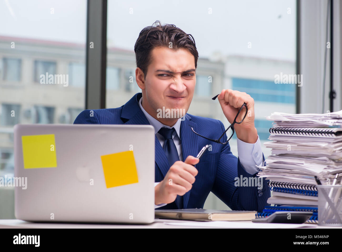 Workaholic businessman overworked with too much work in office Stock ...