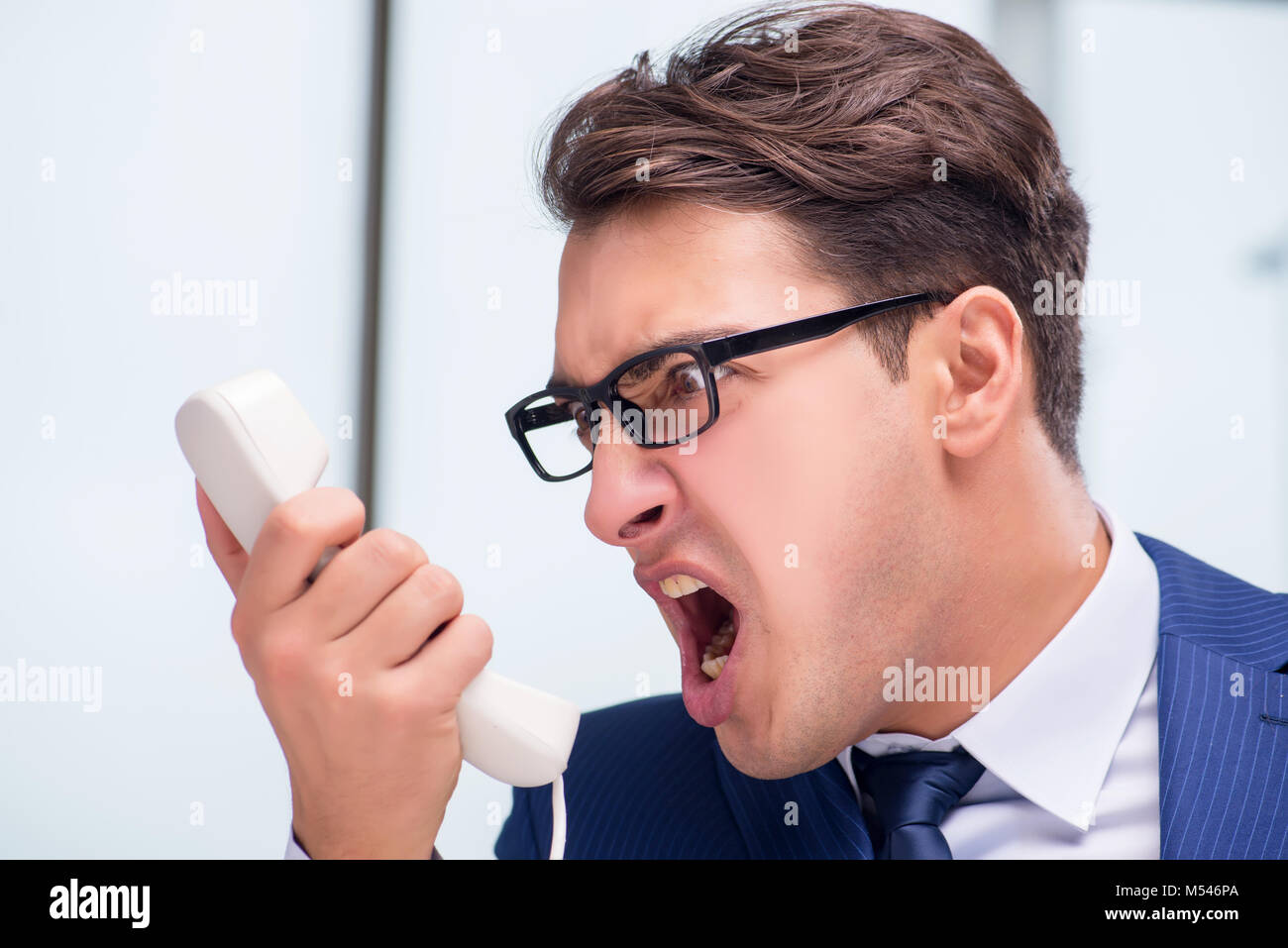 Angry call center employee yelling at customer Stock Photo - Alamy