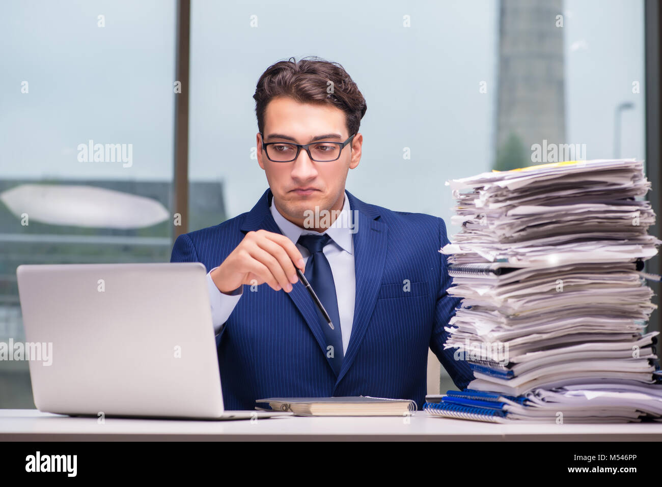 Workaholic businessman overworked with too much work in office Stock ...