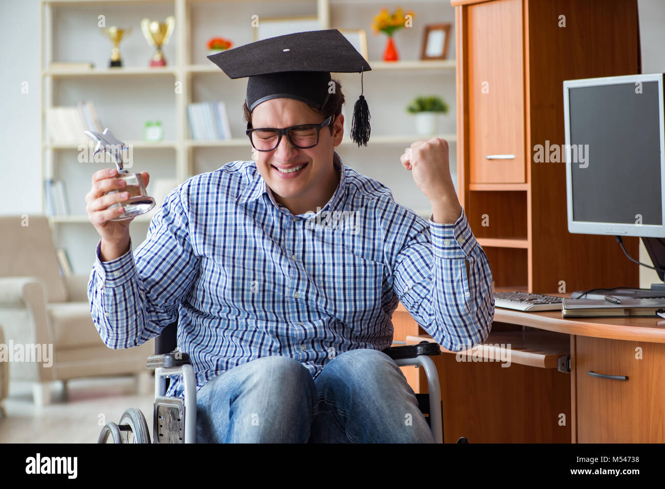 Disabled student studying at home on wheelchair Stock Photo - Alamy