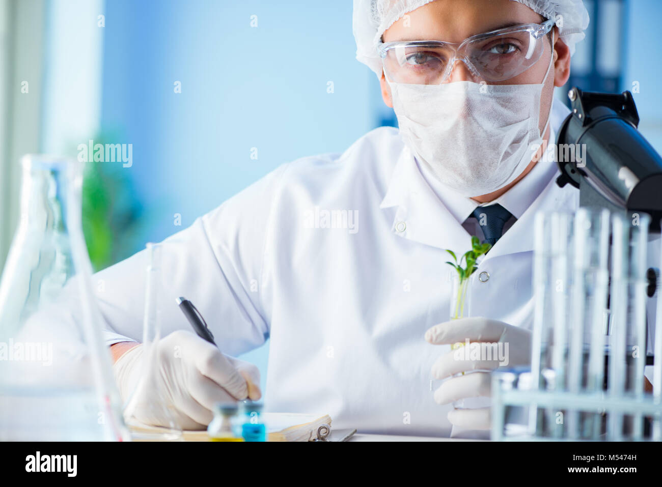 Biotechnology concept with scientist in lab Stock Photo - Alamy