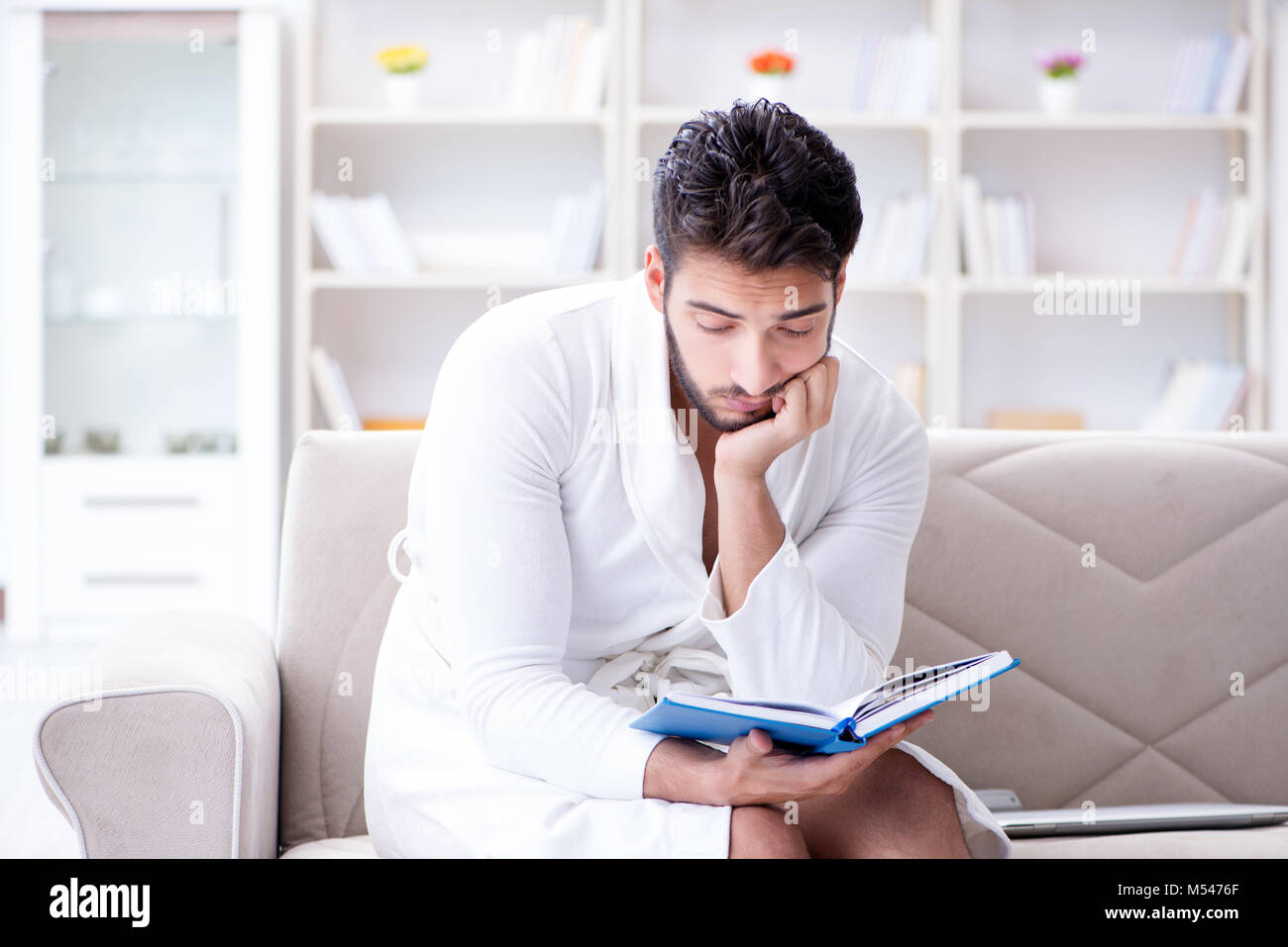 Young man student businessman reading a book studying working at Stock ...