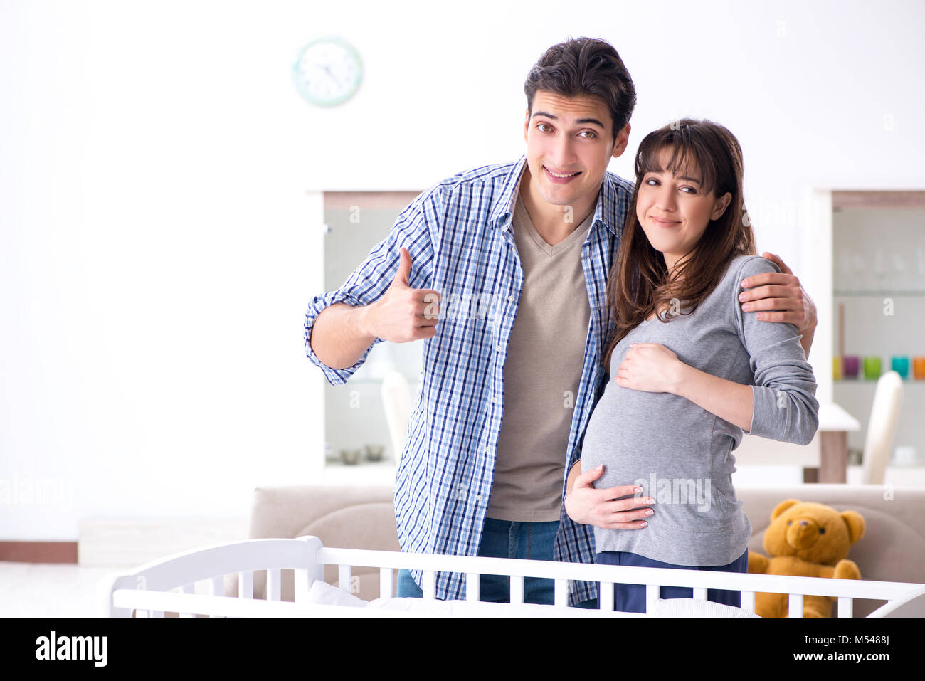 Young parents expecting their first baby Stock Photo - Alamy