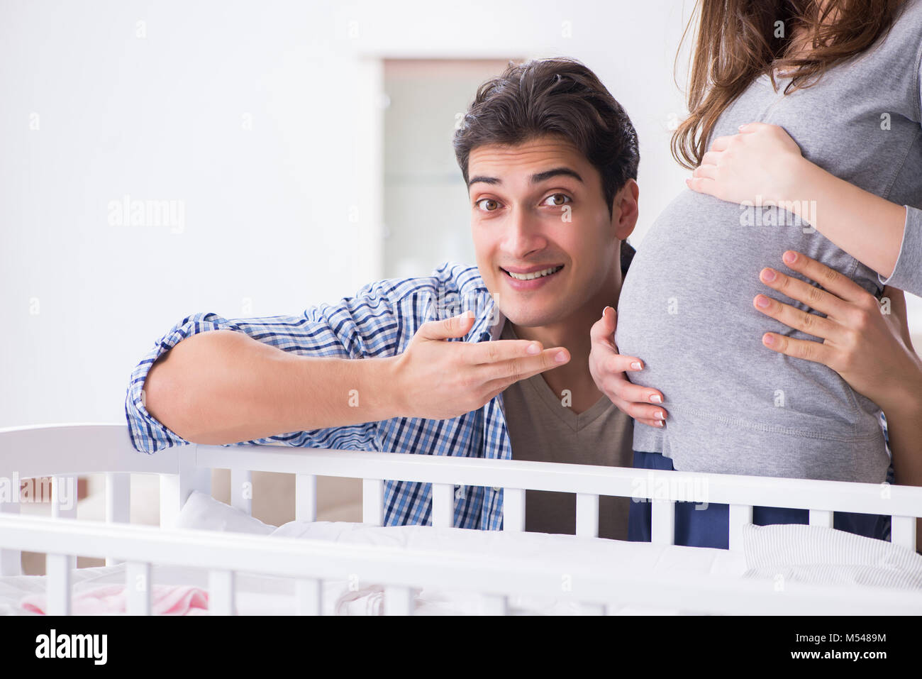 Young parents expecting their first baby Stock Photo - Alamy
