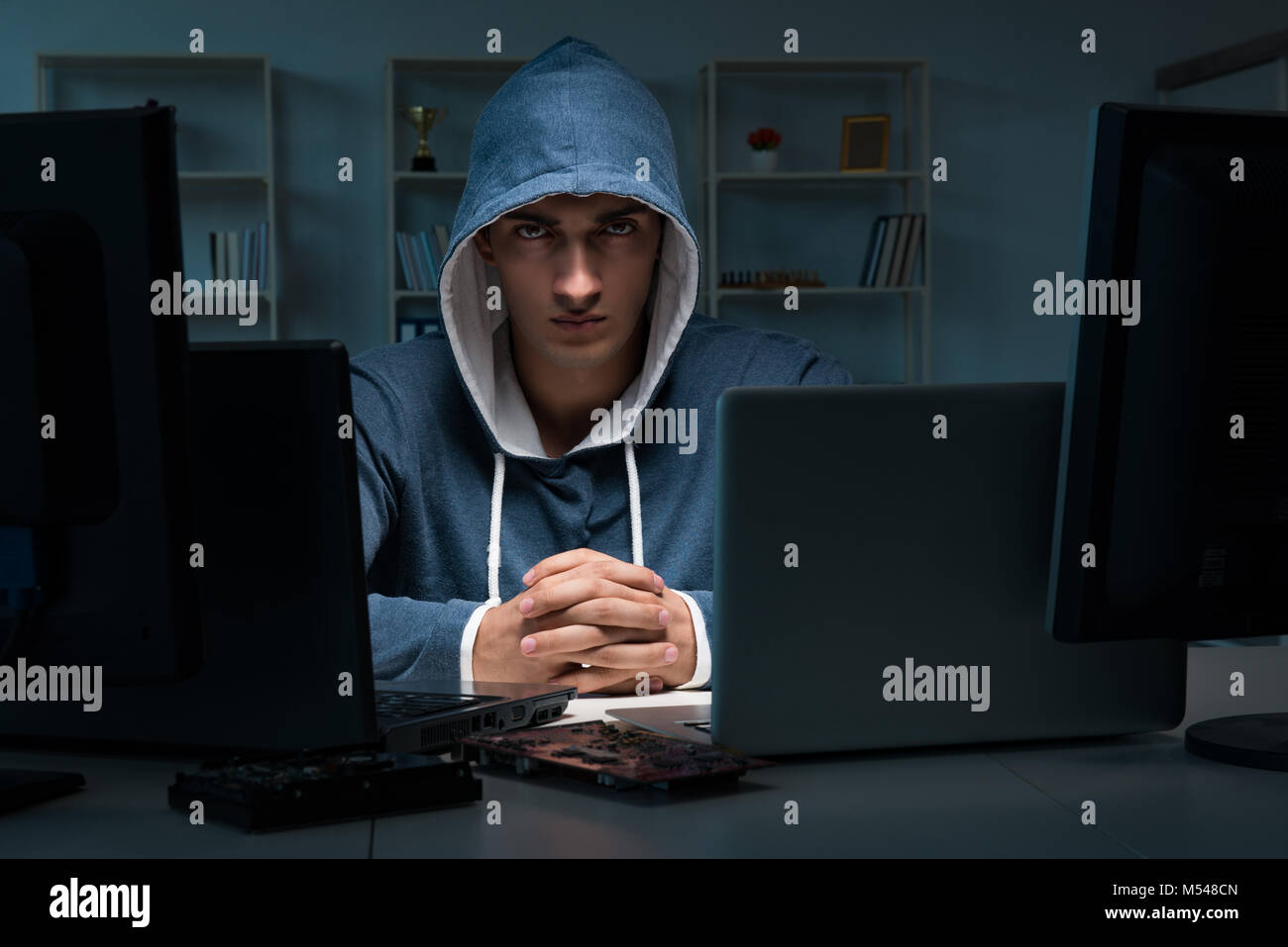 Hacker hacking computer at night Stock Photo - Alamy