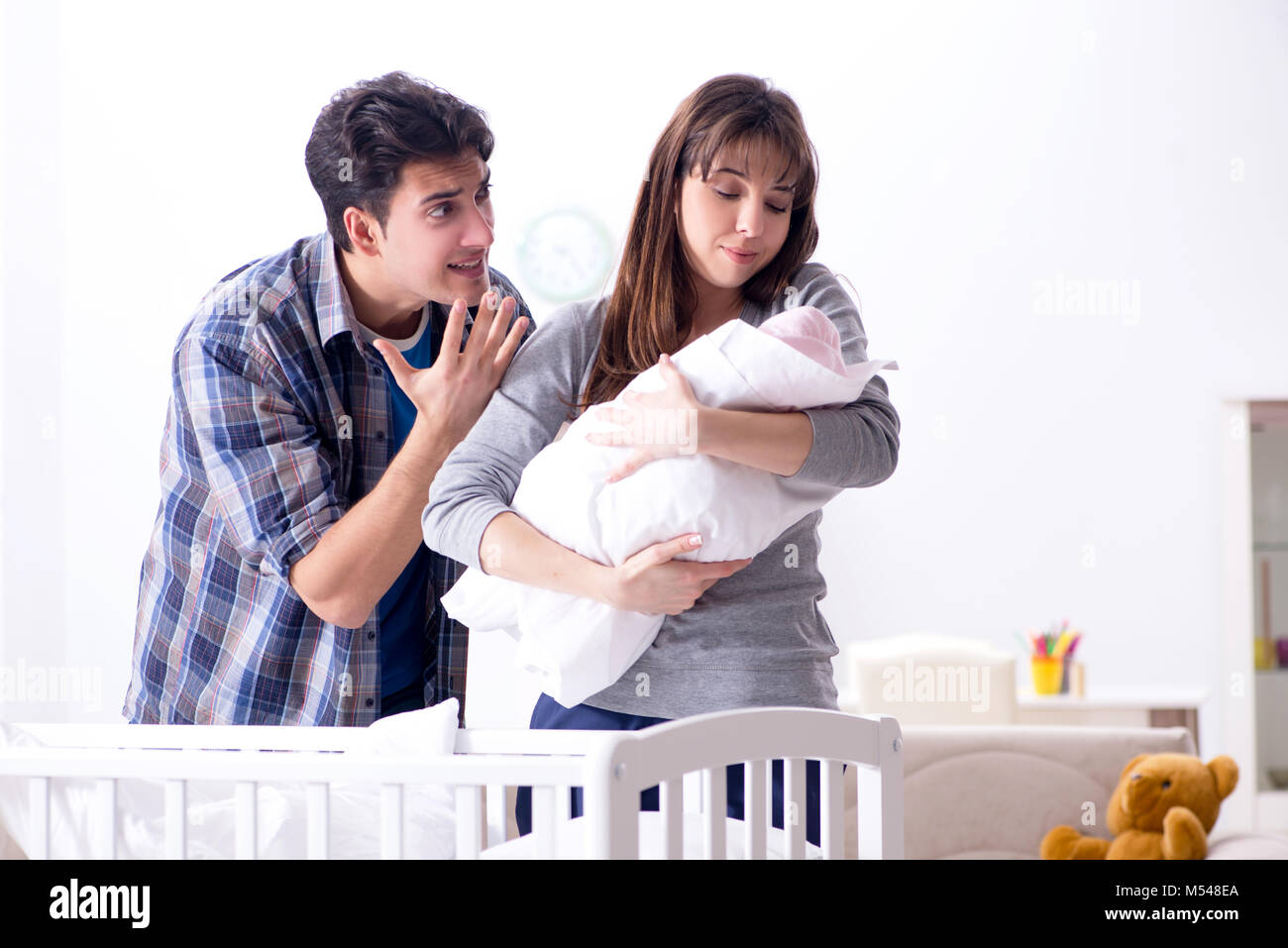 Young dad cannot stand baby crying Stock Photo - Alamy