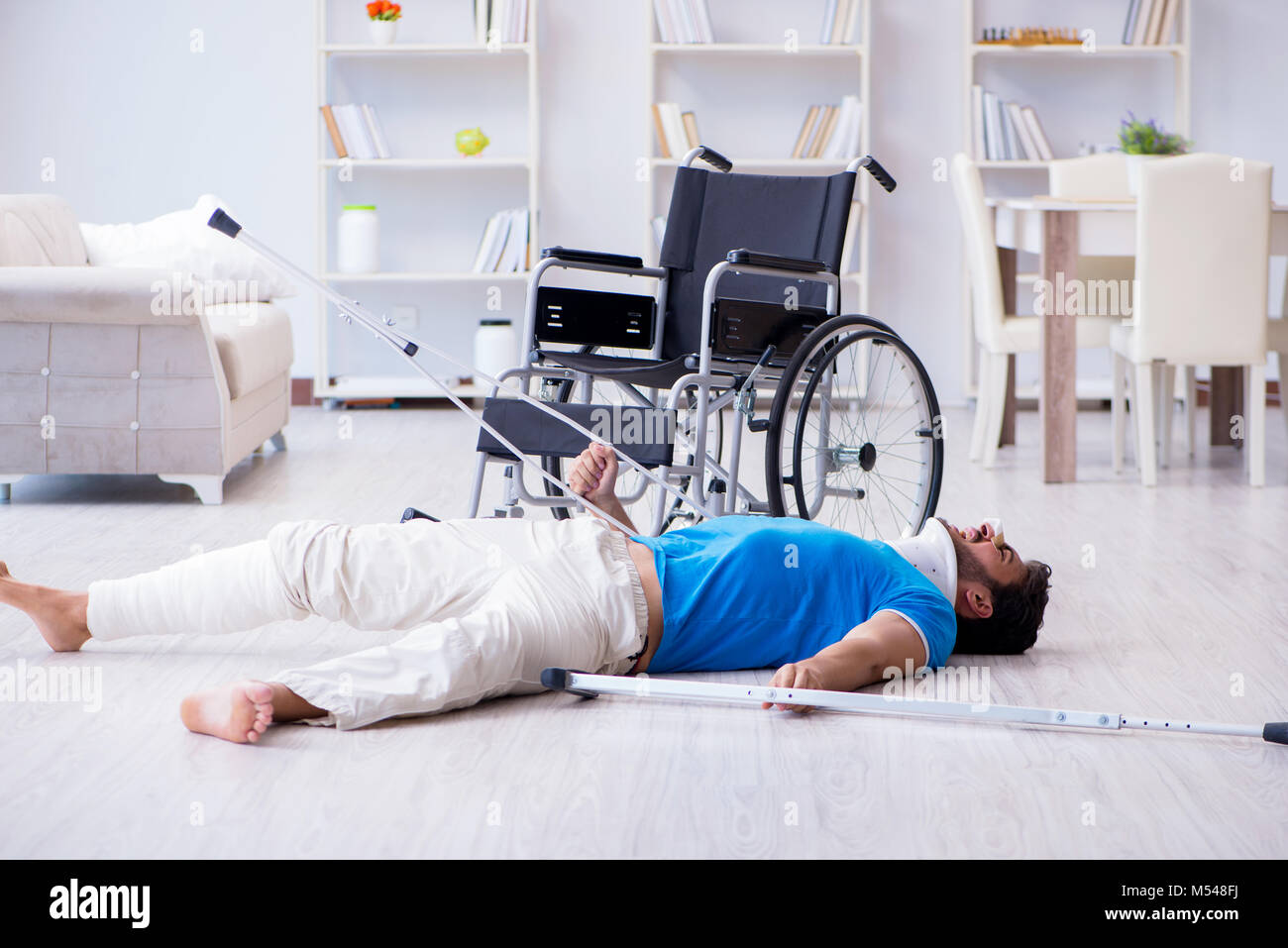 Injured young man recovering at home Stock Photo - Alamy