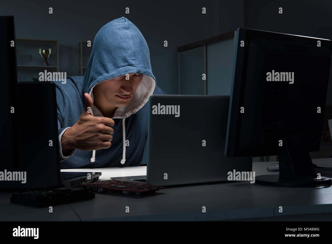 Hacker hacking computer at night Stock Photo - Alamy