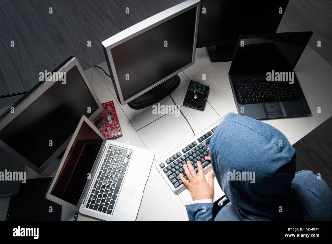 Hacker hacking computer at night Stock Photo - Alamy