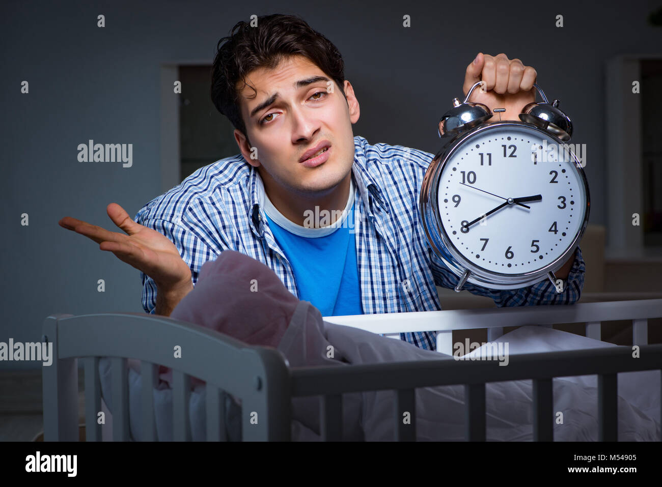 Young father dad sleeping while looking after newborn baby Stock Photo ...