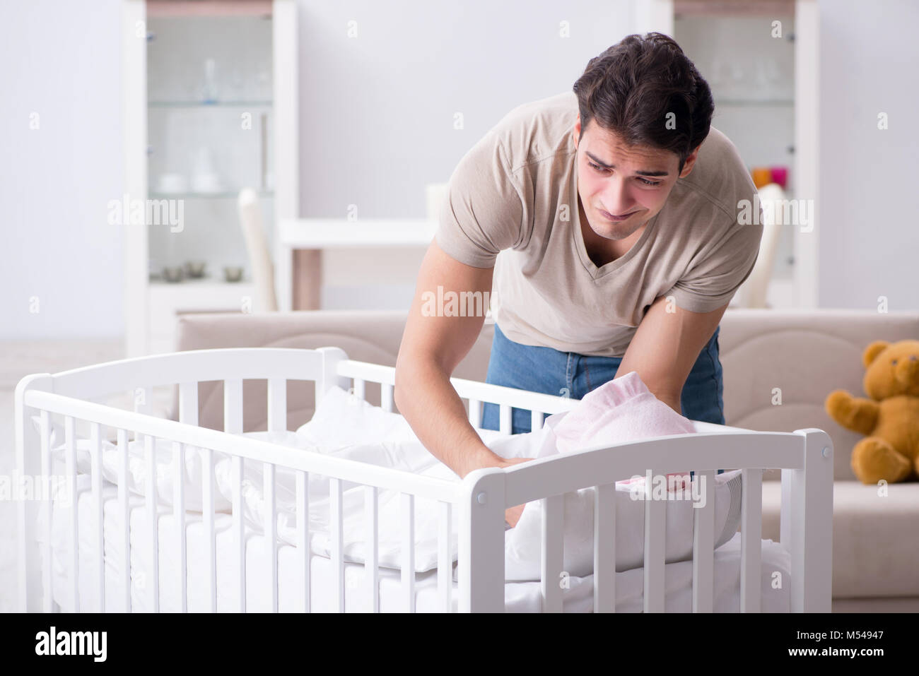 Young father dad frustrated at crying baby Stock Photo - Alamy
