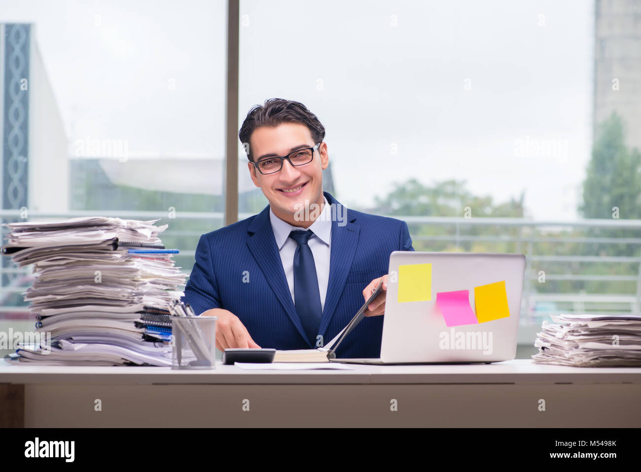Workaholic businessman overworked with too much work in office Stock ...