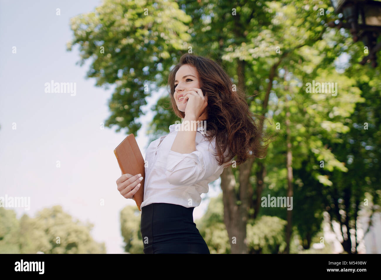 business woman enjoys gadgets Stock Photo - Alamy